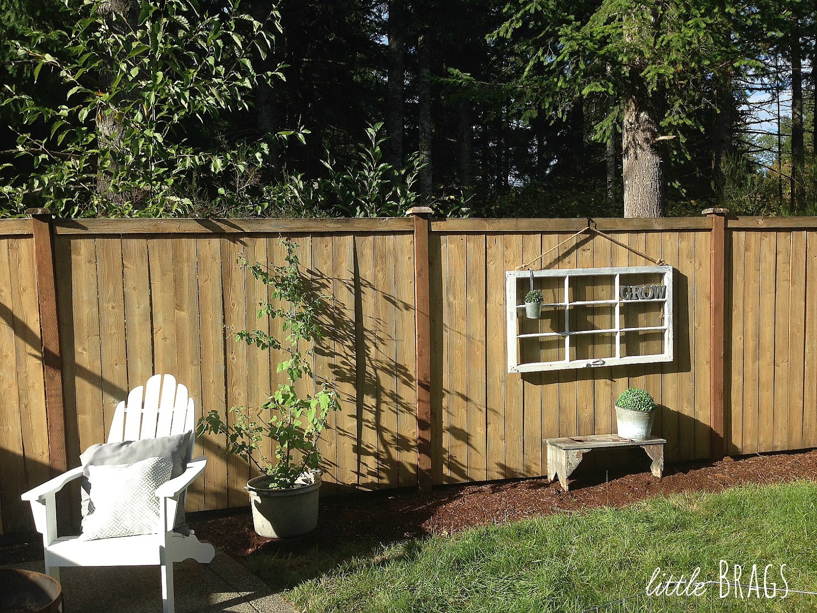 Little Brags: Hanging An Old Window From The Fence