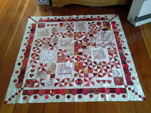 Serendipity Design: Red Brolly Catalicious Quilt is finished with Pucks ...