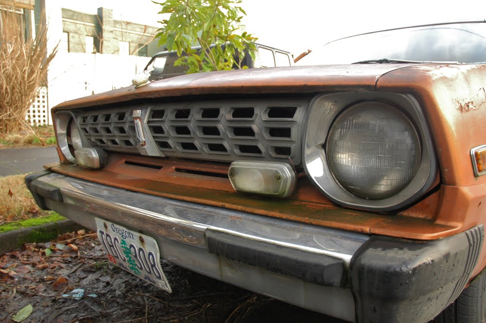 OLD PARKED CARS.: 1977 Plymouth Arrow 160 Hatchback.