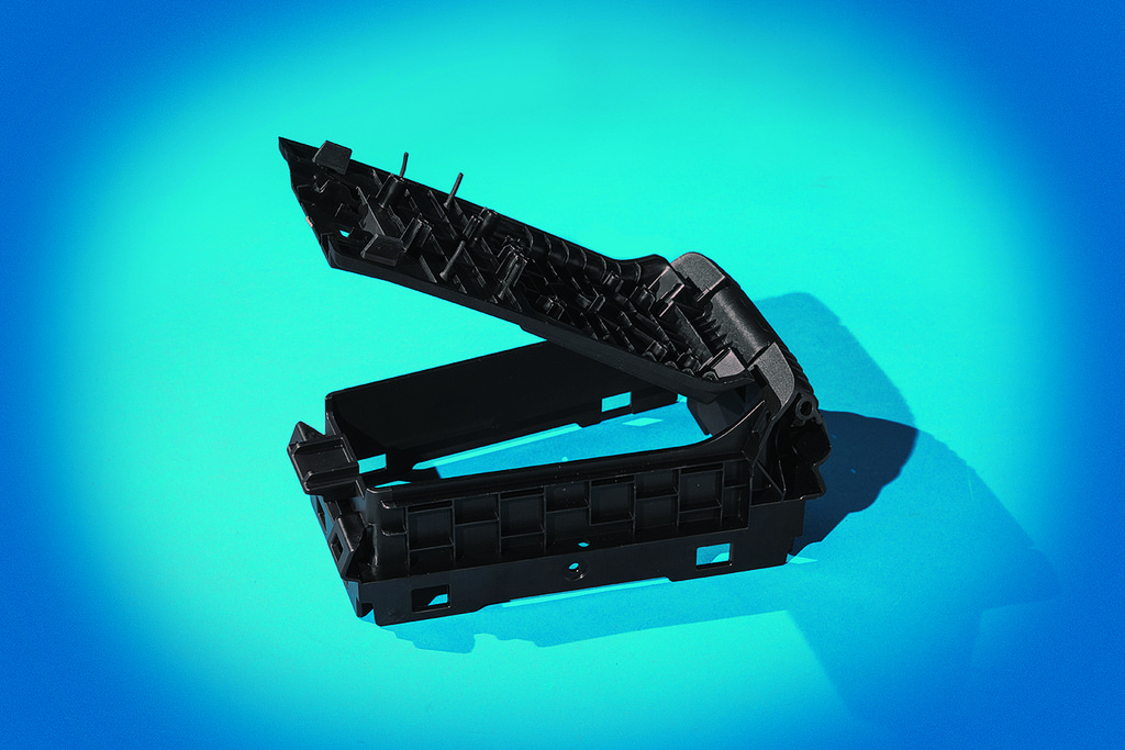 Plastics Car Blog: Integrated Sliding Armrest and Hinge Assembly