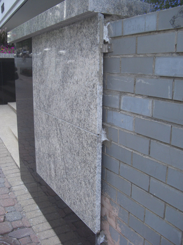 Ode Street Tribune: from dull grey brick to glistening granite