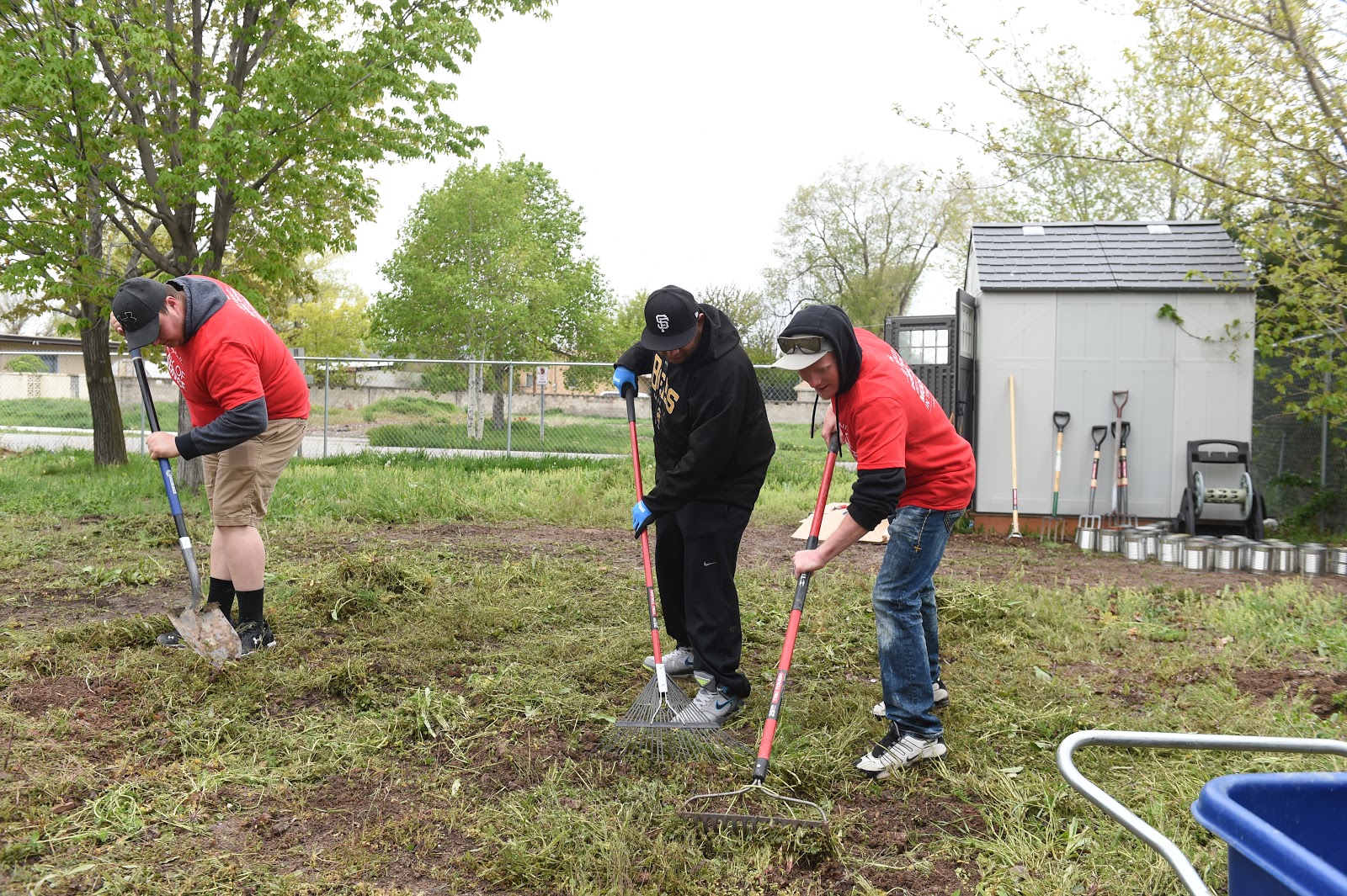Larry H. Miller Group Pitches In At Community Gardens