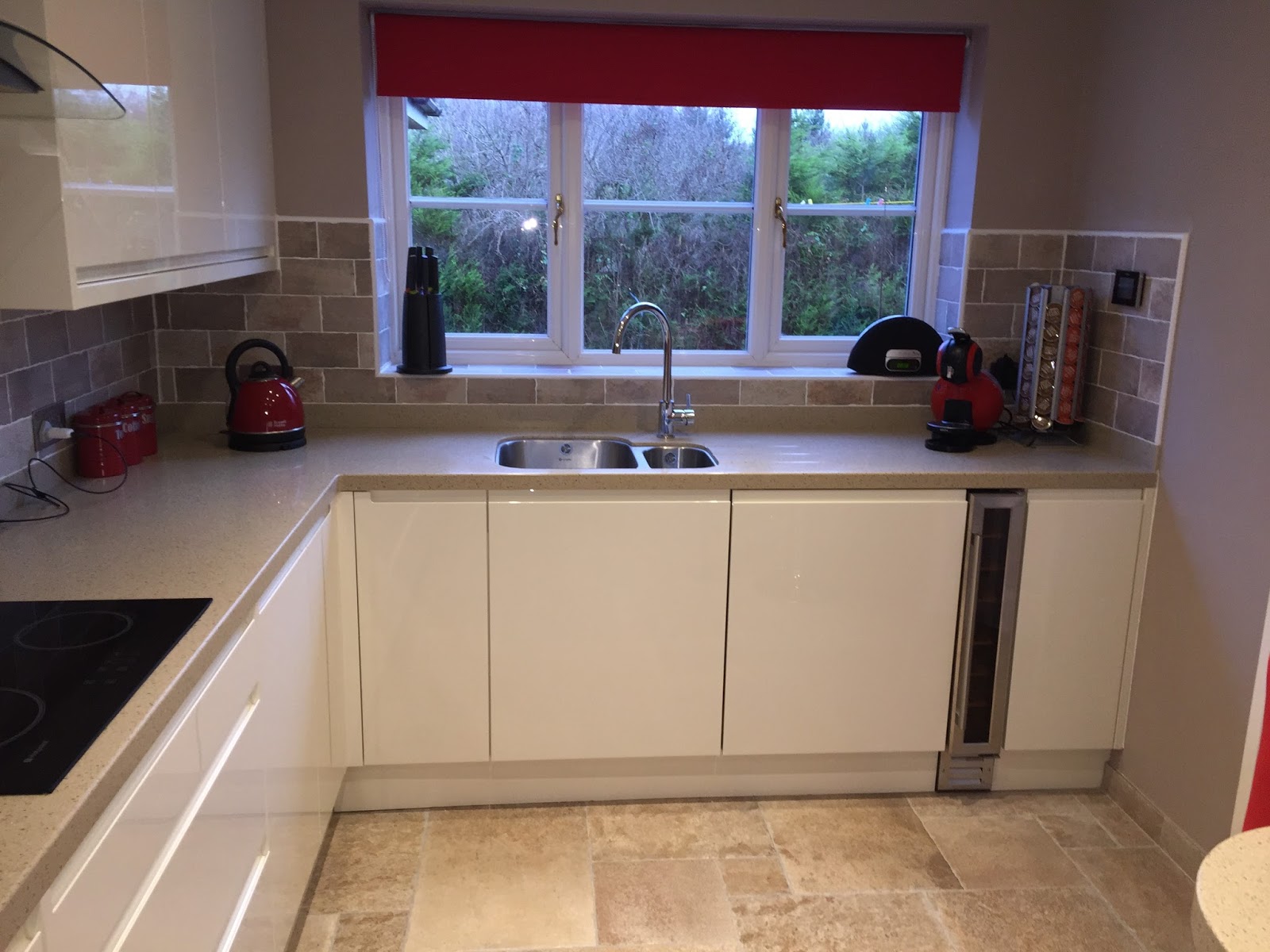 Tates Kitchens: Ivory gloss kitchen with staron tempest worktops ...