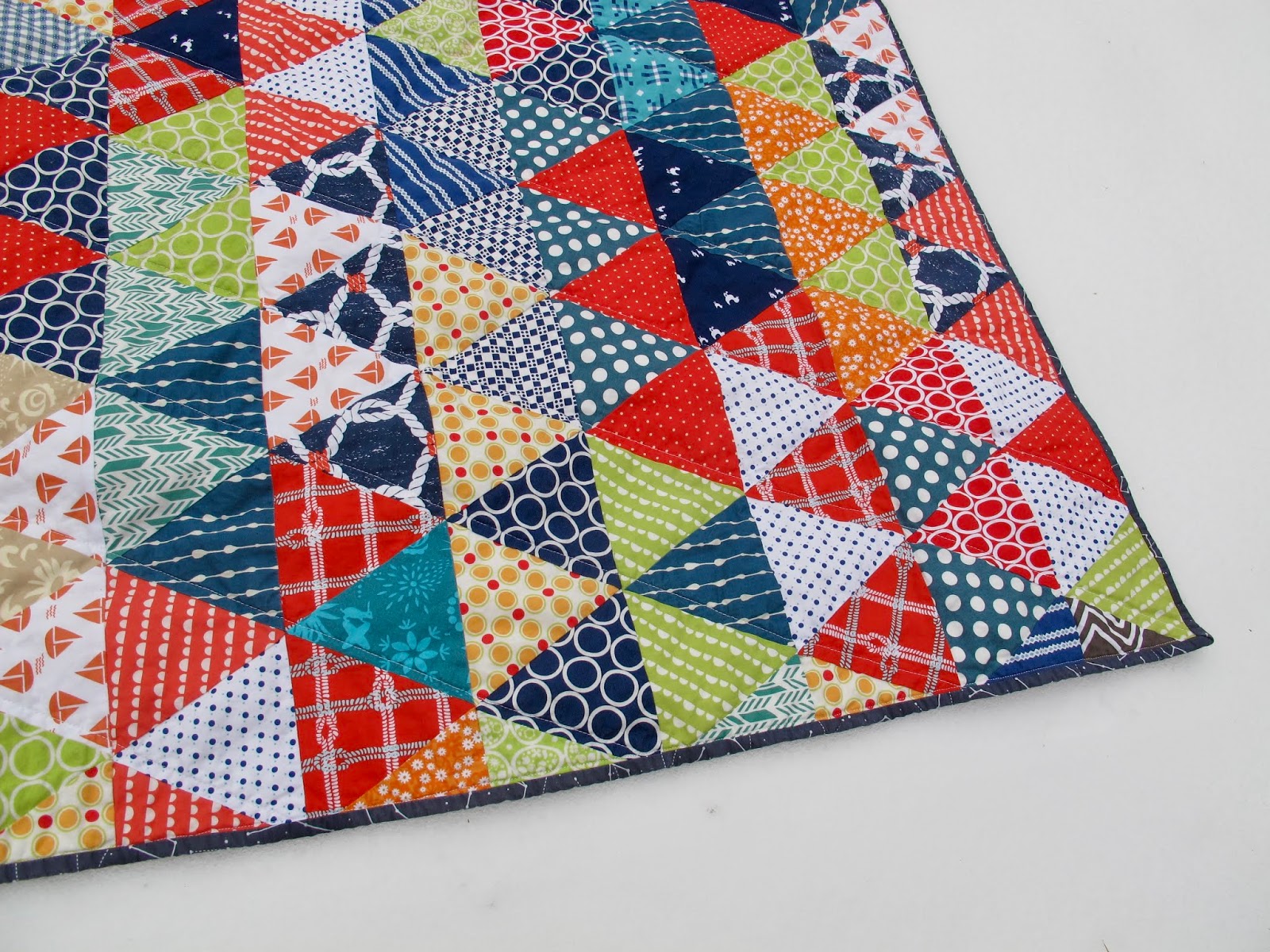 Six White Horses: Triangle Patchwork Baby Quilt