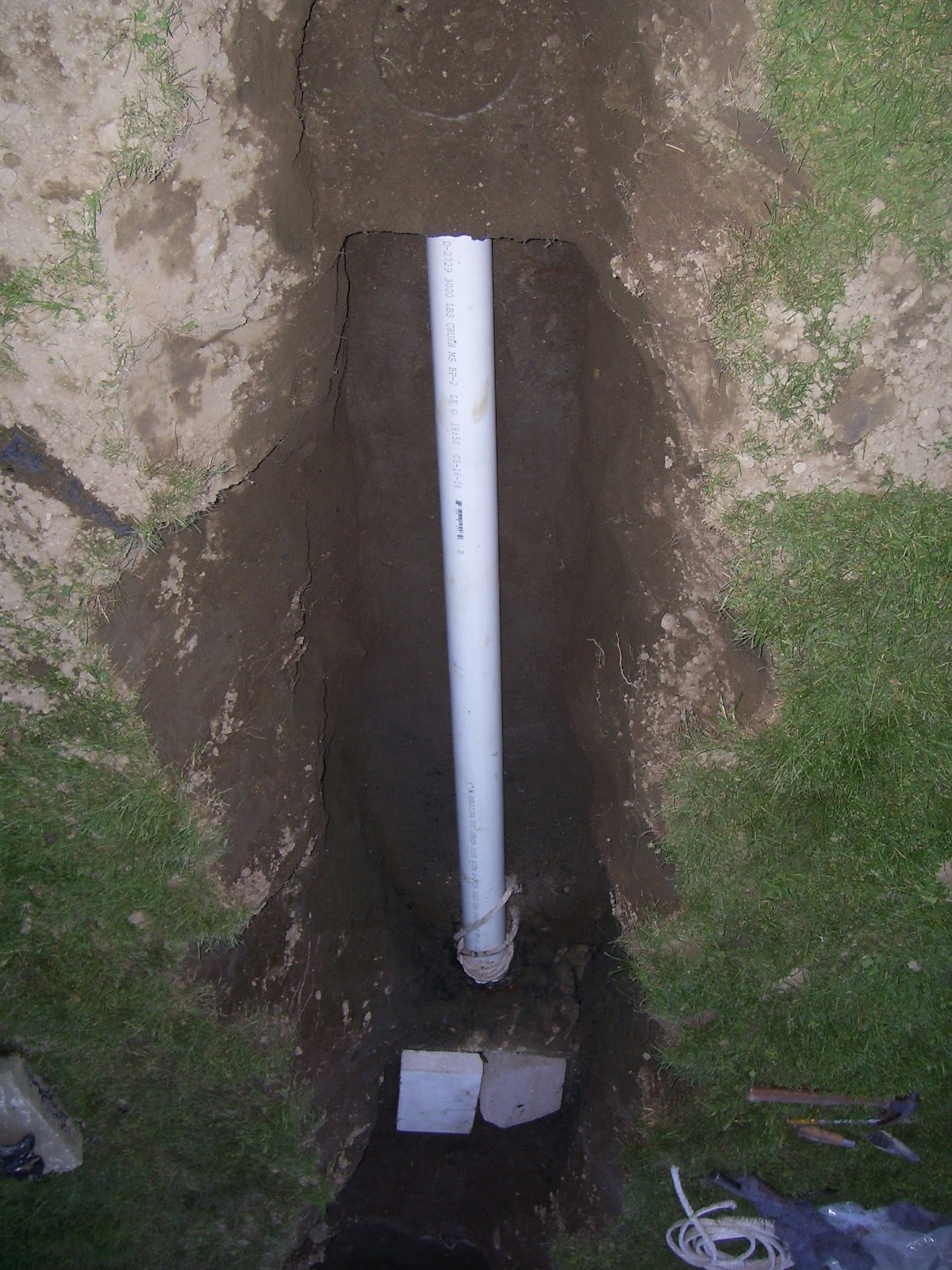 * Digging up my septic tank by hand for my 62nd birthday, 2006
