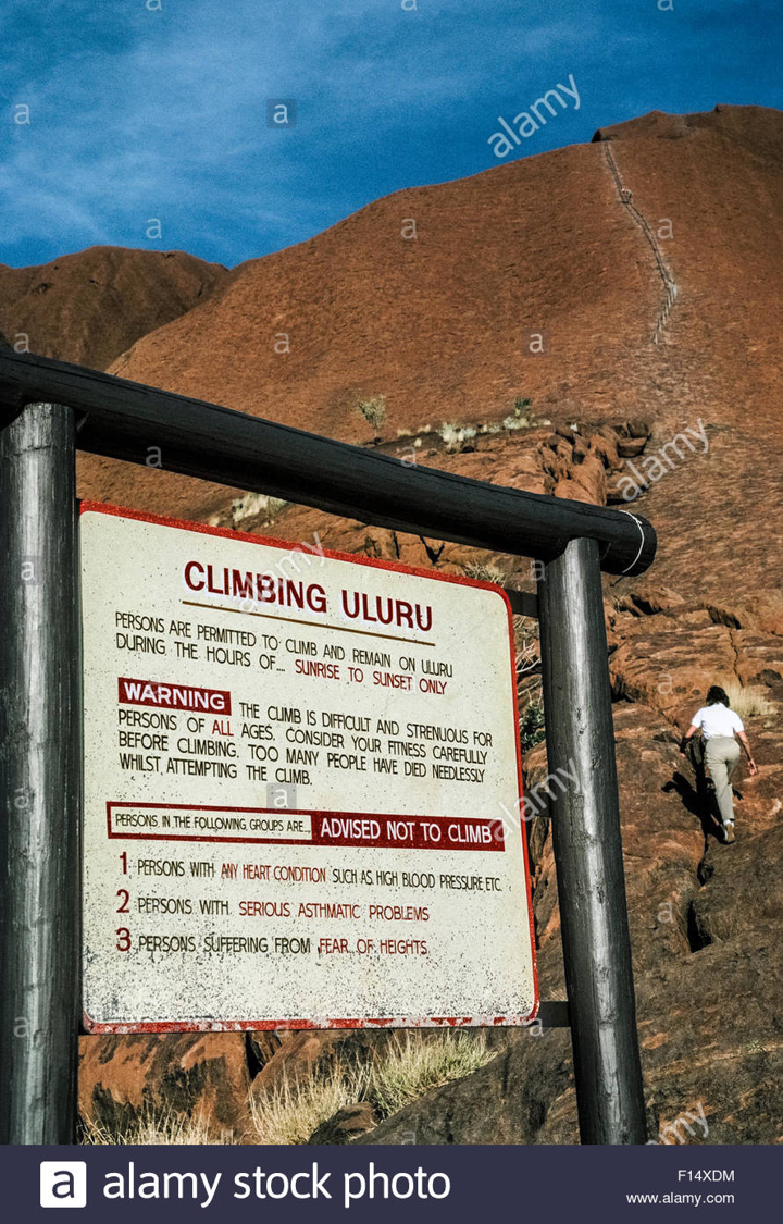 Pictorial history of warning signs at the base of the climb at Ayers Rock