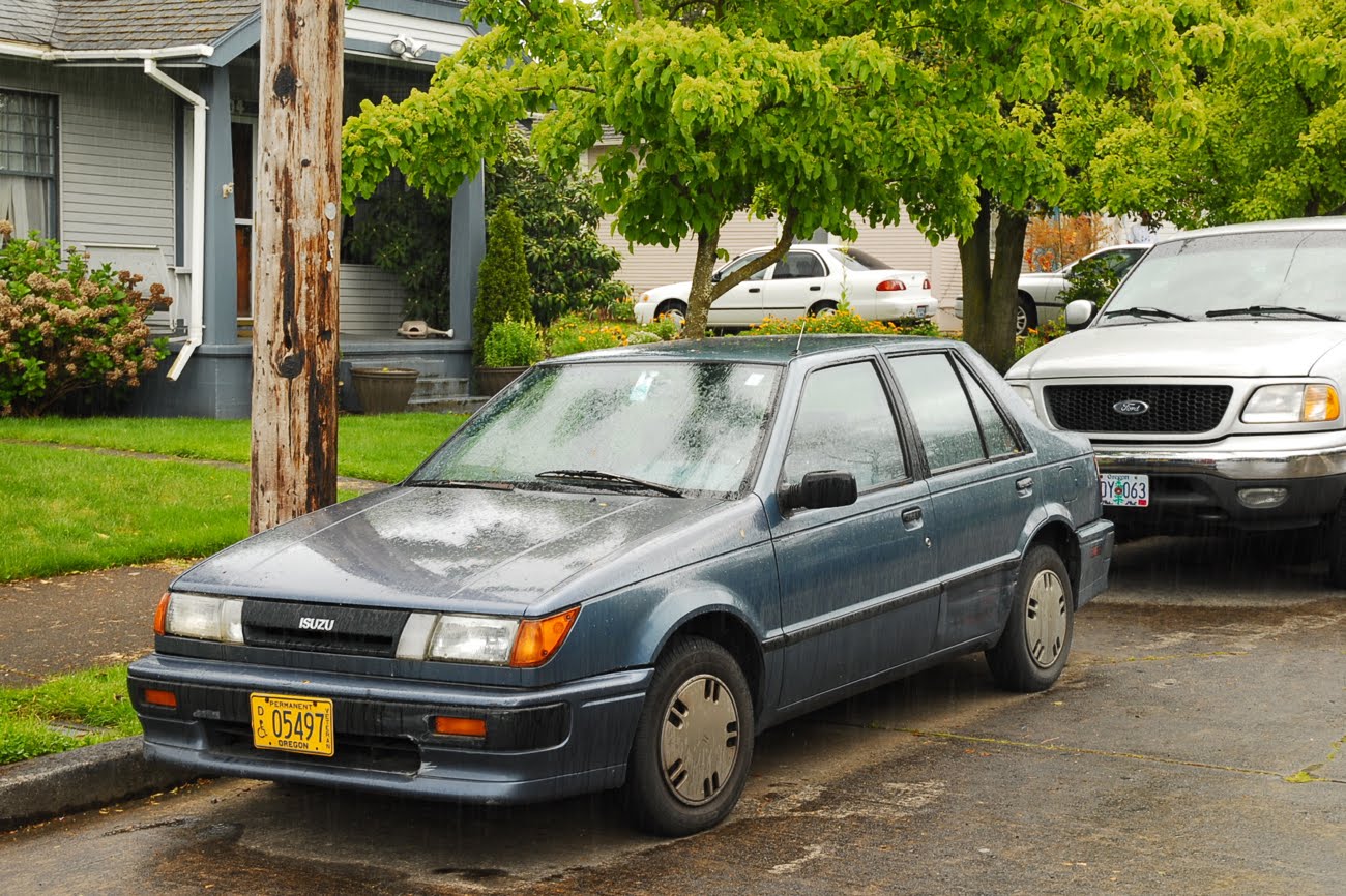OLD PARKED CARS.: 1989 Isuzu i-Mark.