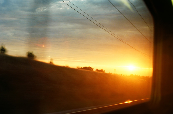 On My Way: Sunset through a train window
