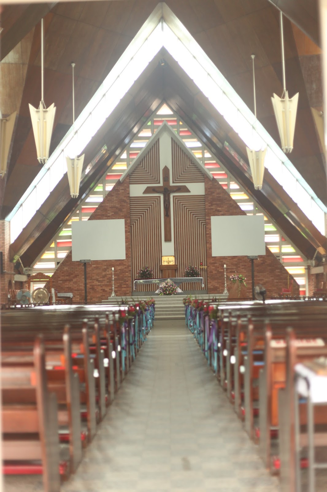 Cross and pews inside a church free picture for commercial use