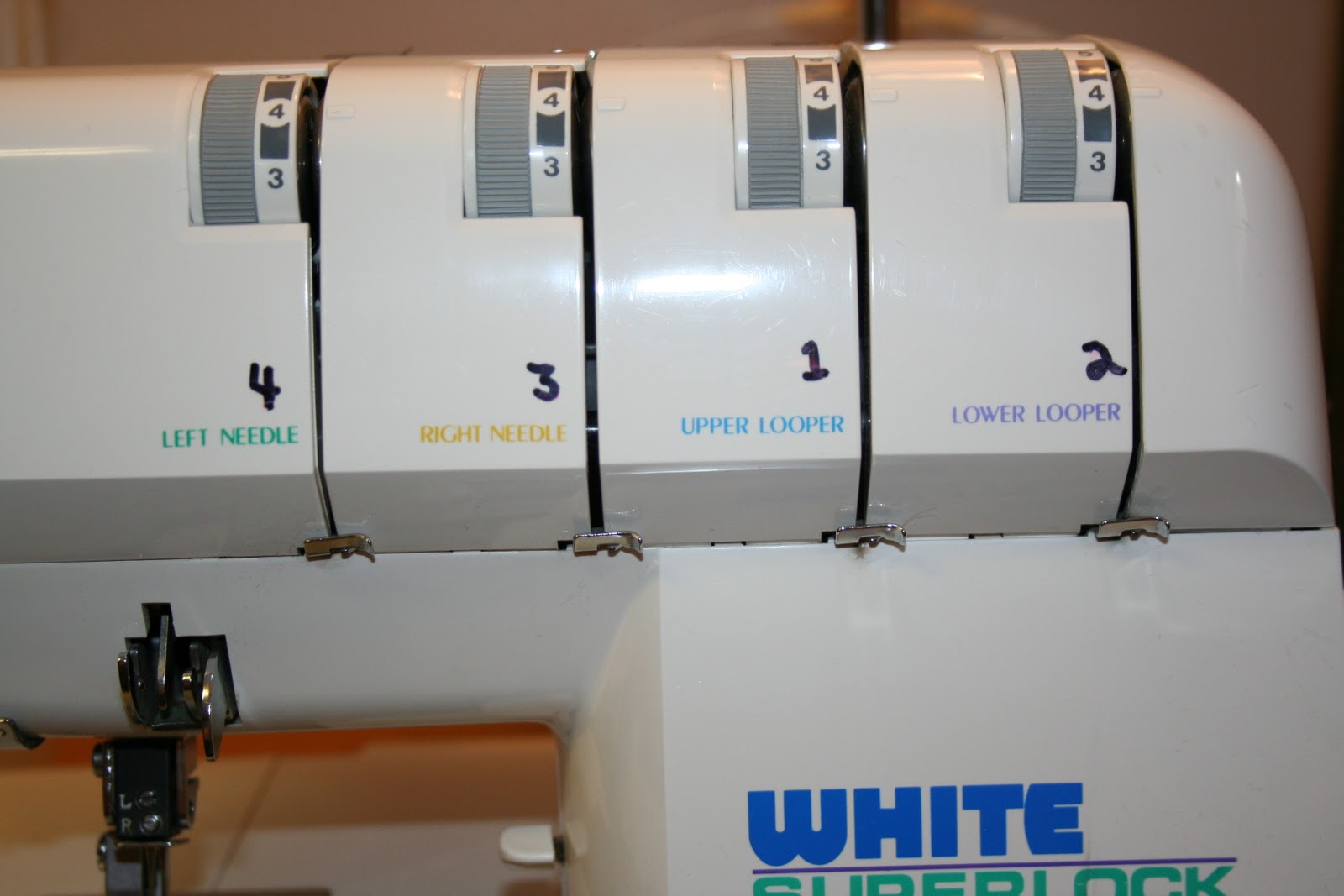 Tammy's Craft Emporium: White Superlock 2000 serger and dog bed.