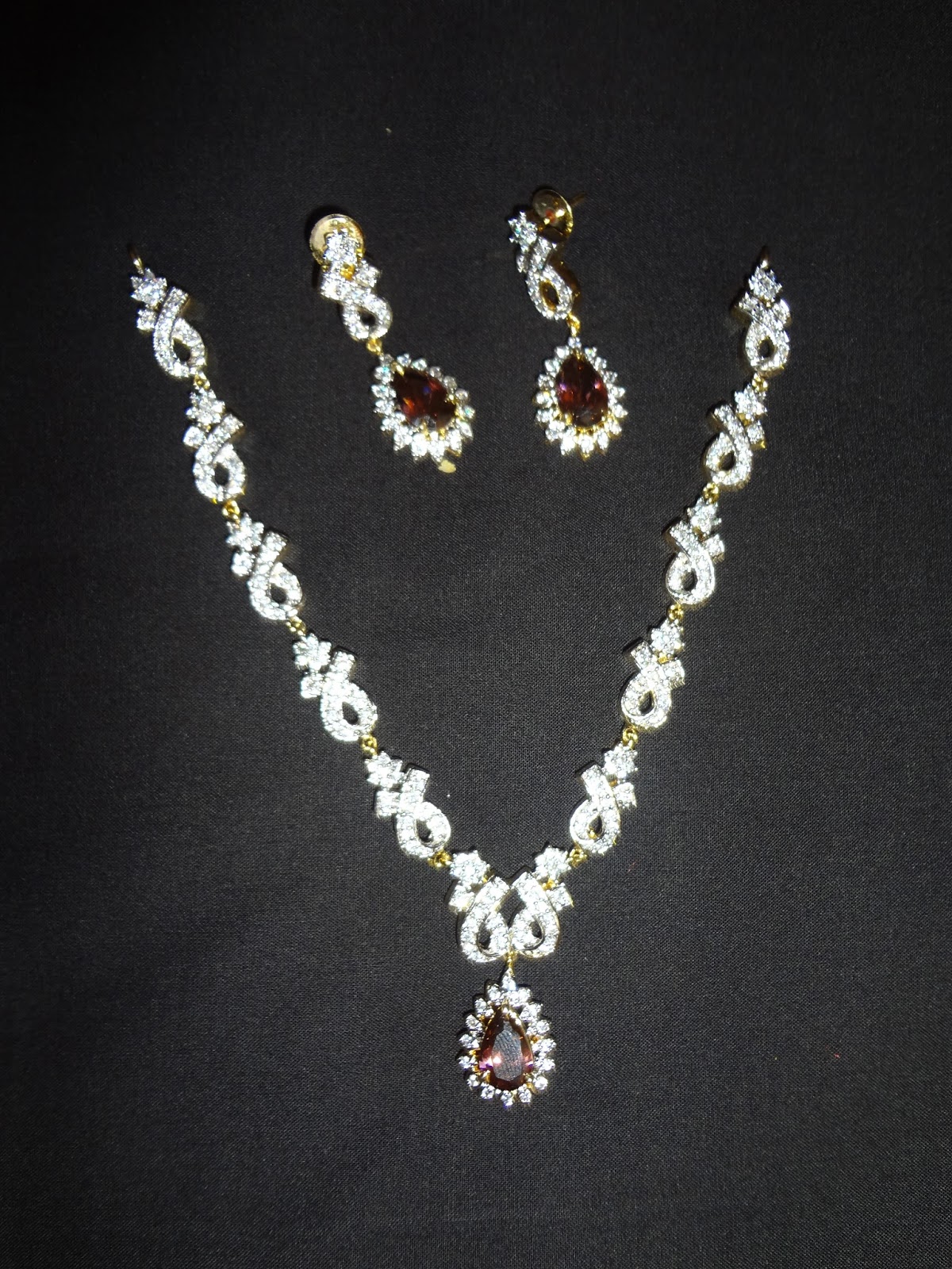 Swarupini: AMERICAN DIAMOND JEWELRY.............18 CT GOLD POLISHED ...