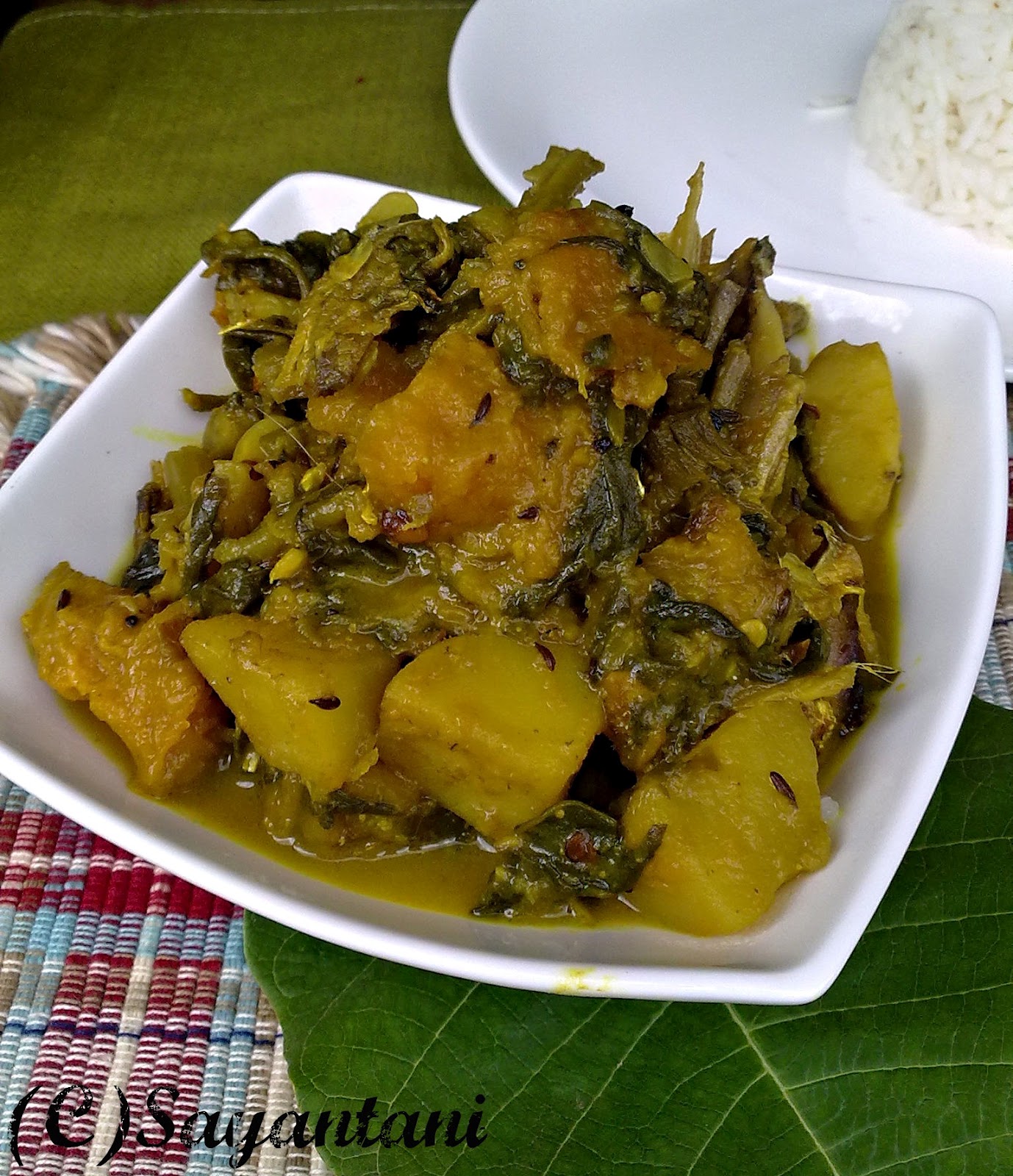 Ilish Macher Matha die Pui Shaaker chorchori (Malabar Spinach cooked ...