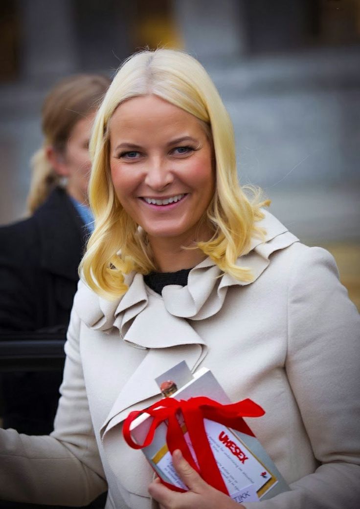 Crown Princess Mette Marit visits Too Young to Wed exhibition