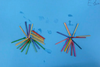 De Mello Teaching: Colored sticks on Cardboard