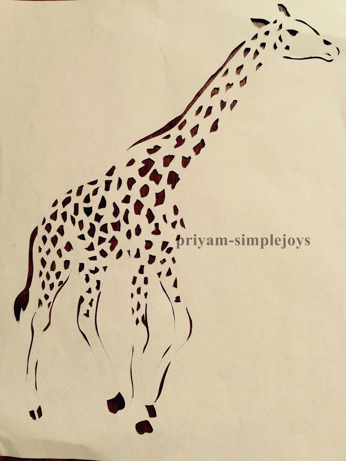 SimpleJoys: Paper cutting - A giraffe cut out.