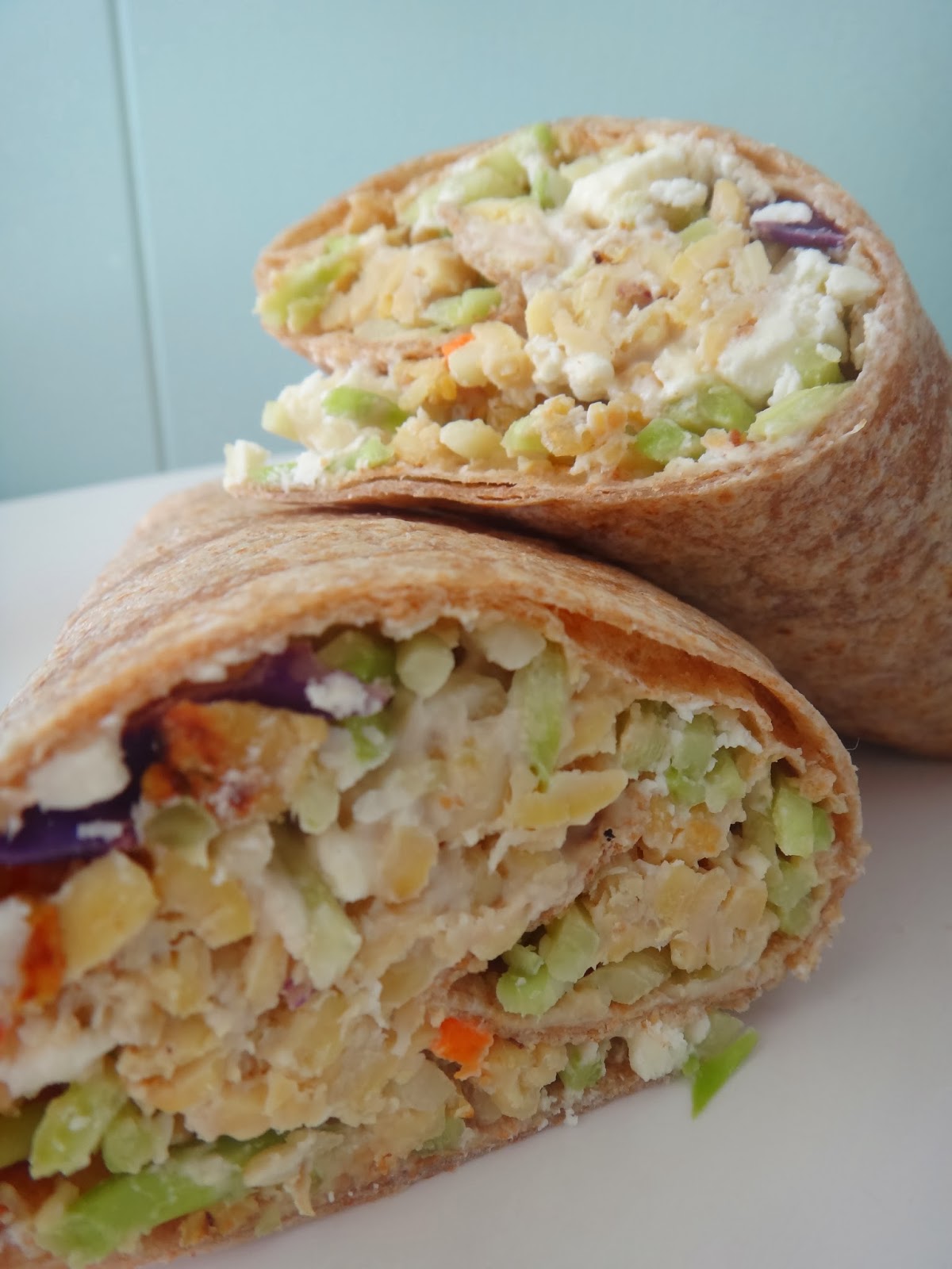 Tahini Tempeh Wrap with Hummus, Feta and Broccoli Slaw