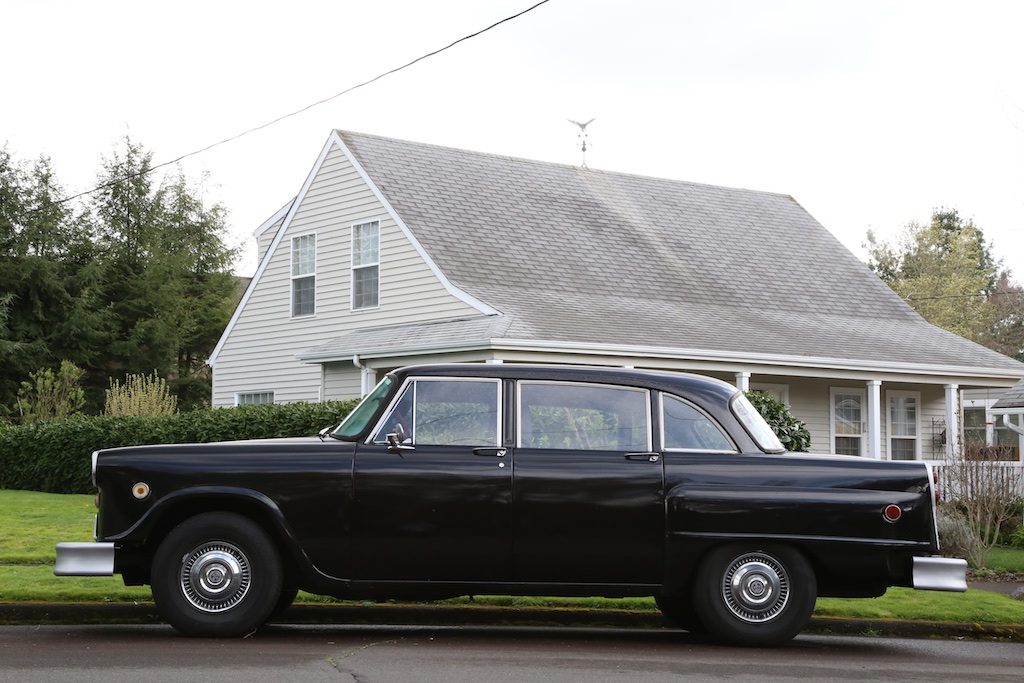 OLD PARKED CARS.: 1975 Checker Marathon.