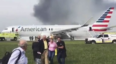 American Airlines plane catches fire at Chicago Airport, 8 injured ...