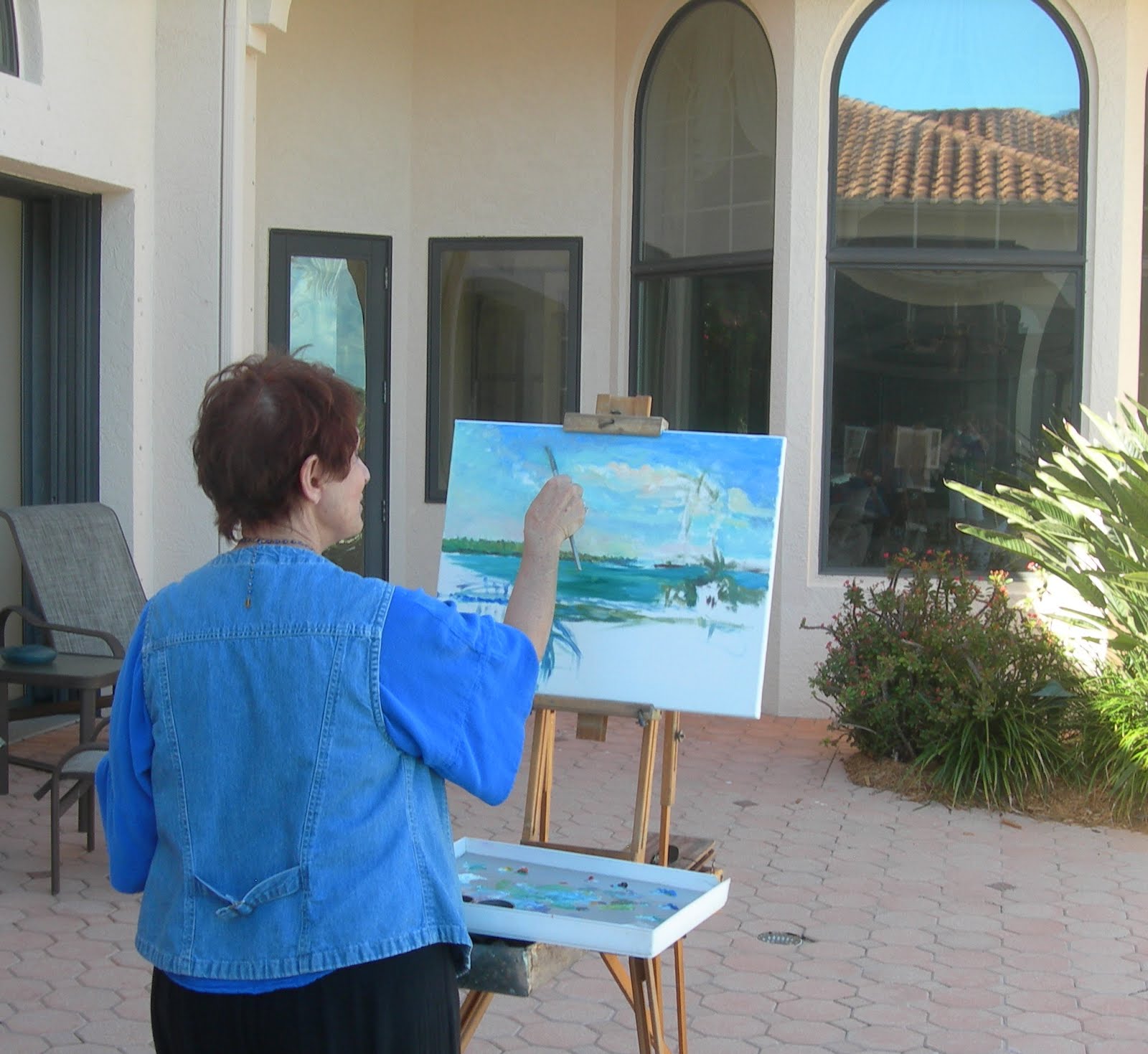 Marco Island Outdoor Artists: Phyllis with her oil painting