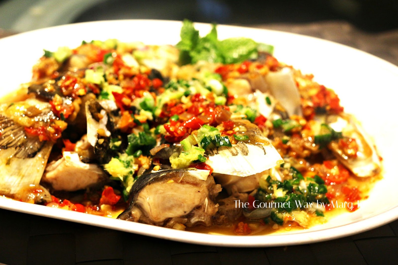 Steamed Fish Head with Homemade Chopped Chili Pepper Sauce . 自家剁椒蒸魚頭