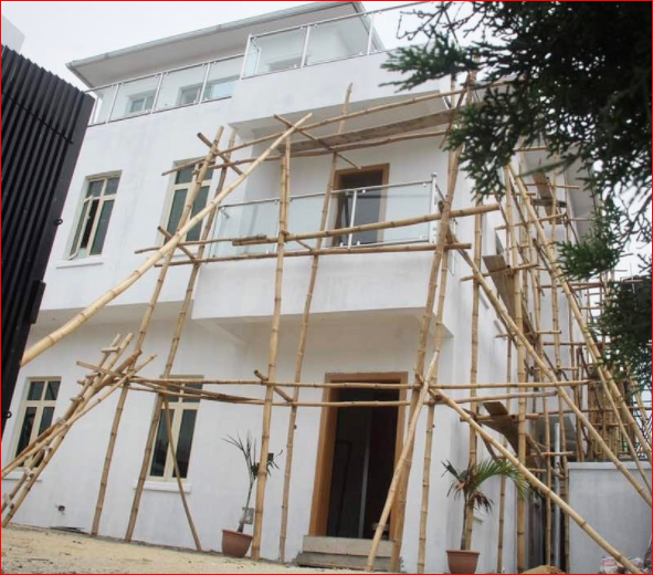 Davido, the uncompleted building and the renovated house