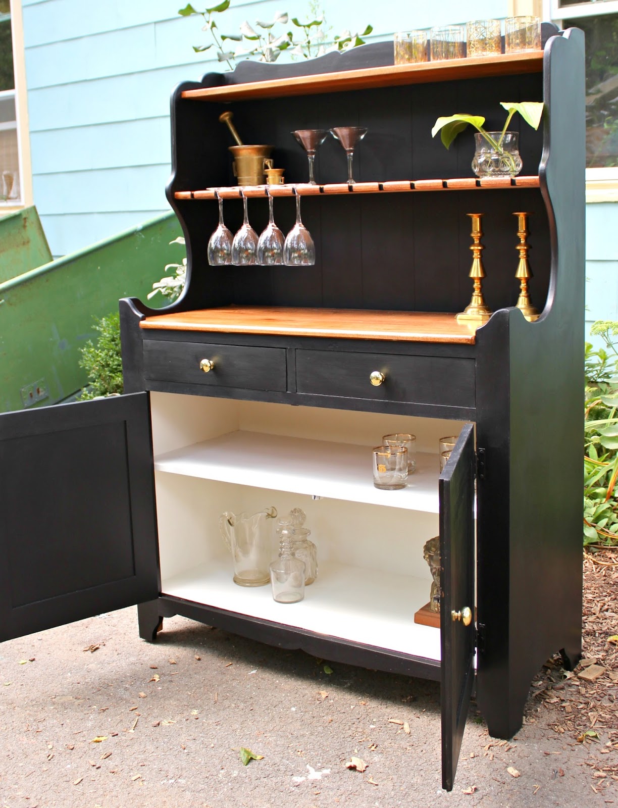 Heir and Space: A Maple Stepback Cupboard in Black