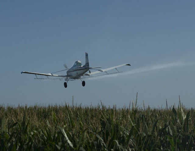 Bailey's Buddy: Aerial Spraying Acrobatics! Photos by Bob Kelly