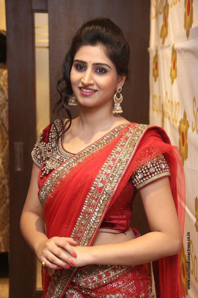 Varshini Sounderajan in red half saree stills - South Indian Actress