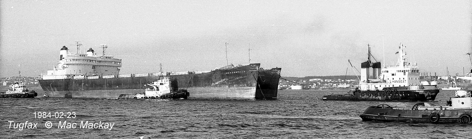 The SMIT Tug Elbe conducting a tandem-tow of decommissioned Escort ...