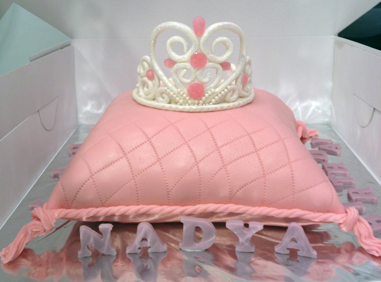 Joyous Cake Company: Princess Pillow cake with edible sugar Tiara and Gems