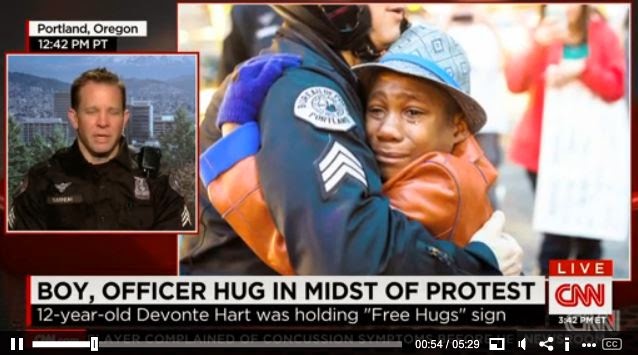 Times of Ahmad: USA: Photo Of Young Boy Hugging Officer At Ferguson ...