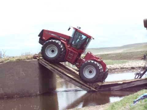 Tractor: Tractor on bridge cave-in