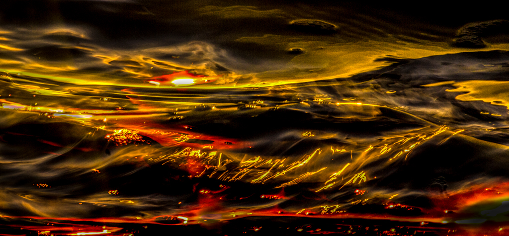 The Sun was sketching surreal landscapes on the surface of the water...