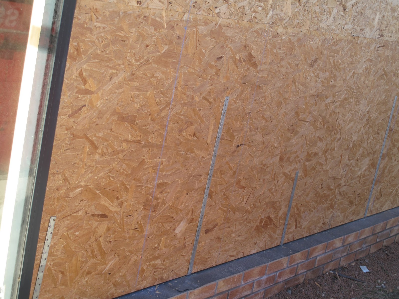 Modest Designs: OSB Cladding going up