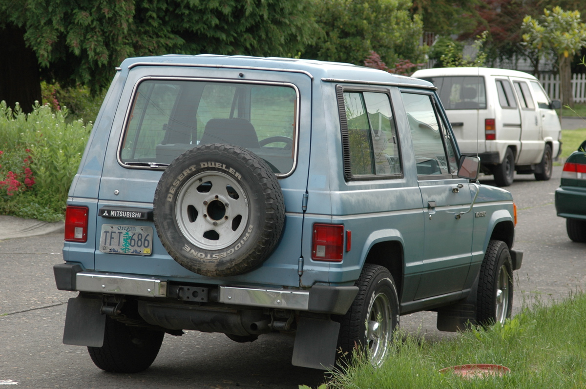 OLD PARKED CARS.: 1983 Mitsubishi Montero.