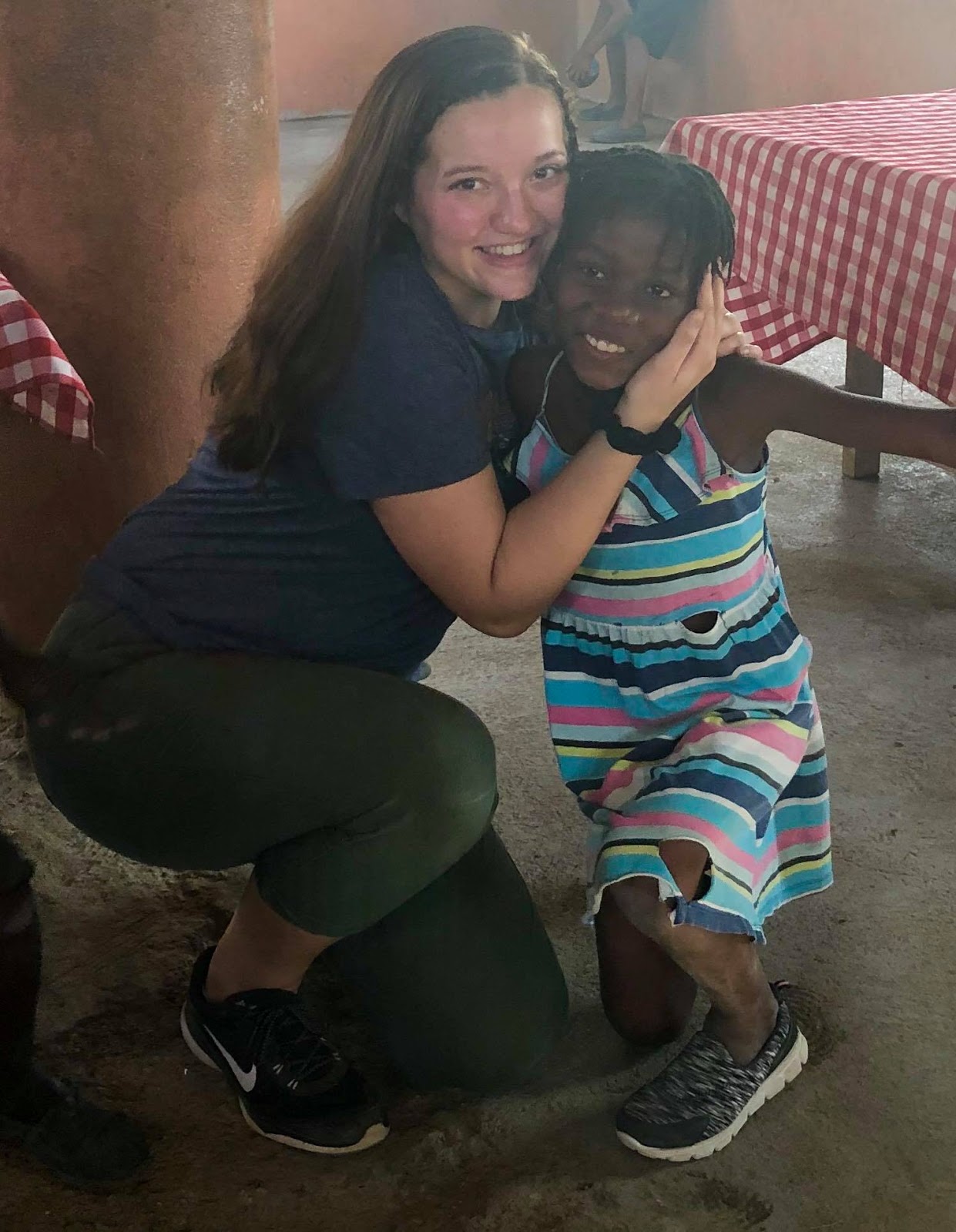 Ashlee Burris serves at orphanages in Haiti with Lori Shannon