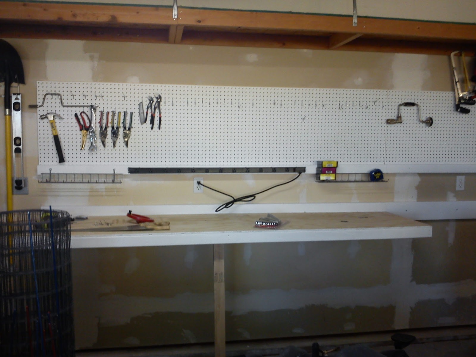 From a Distance: 16 foot wall mounted workbench with pegboard