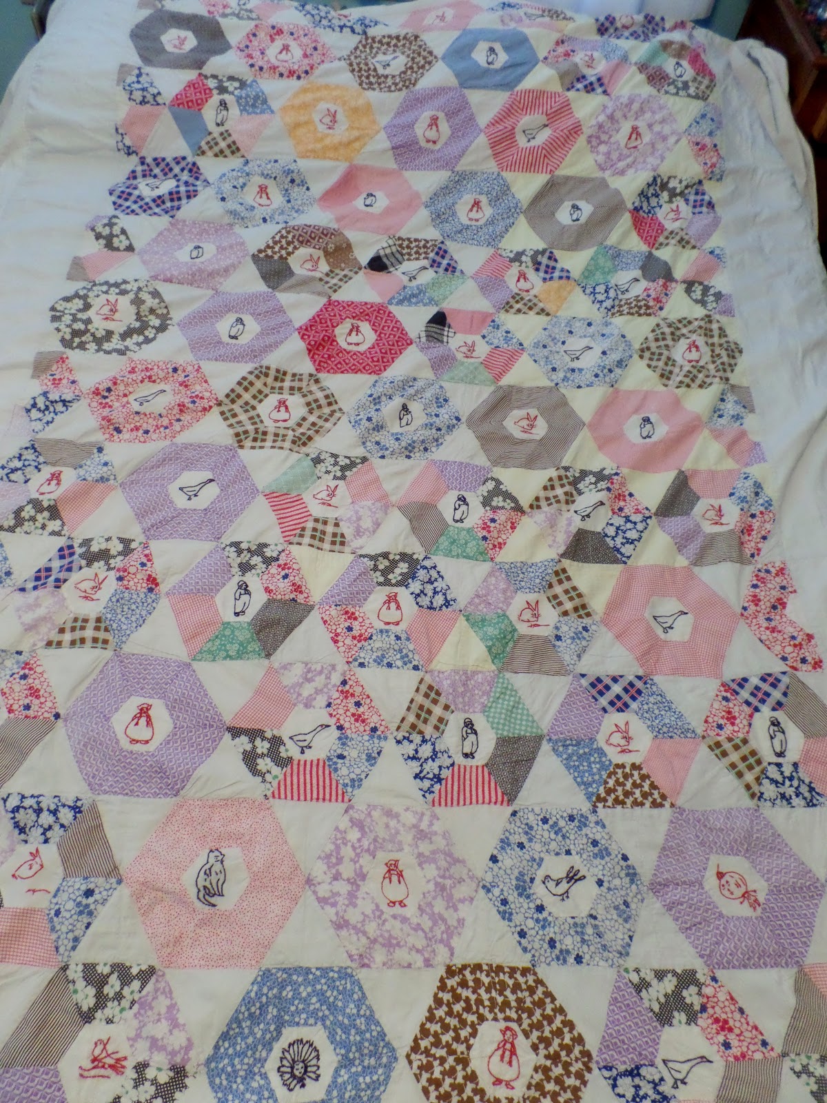 Pennsylvania Piecemaker: Wagon Wheel Embroidered Quilt