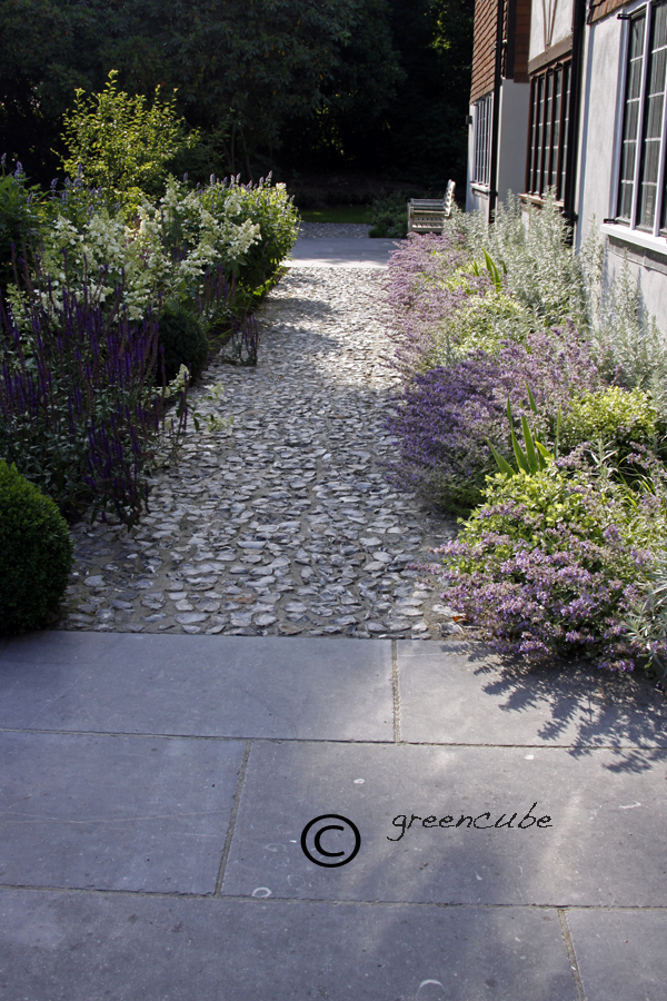 Knapped flint paths Arts and Crafts House in Sevenoaks