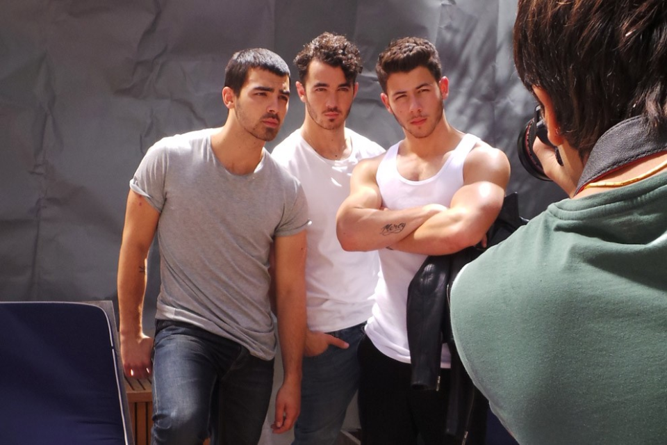 The Randy Report: Photo shoot: Nick Jonas & his biceps and his brothers