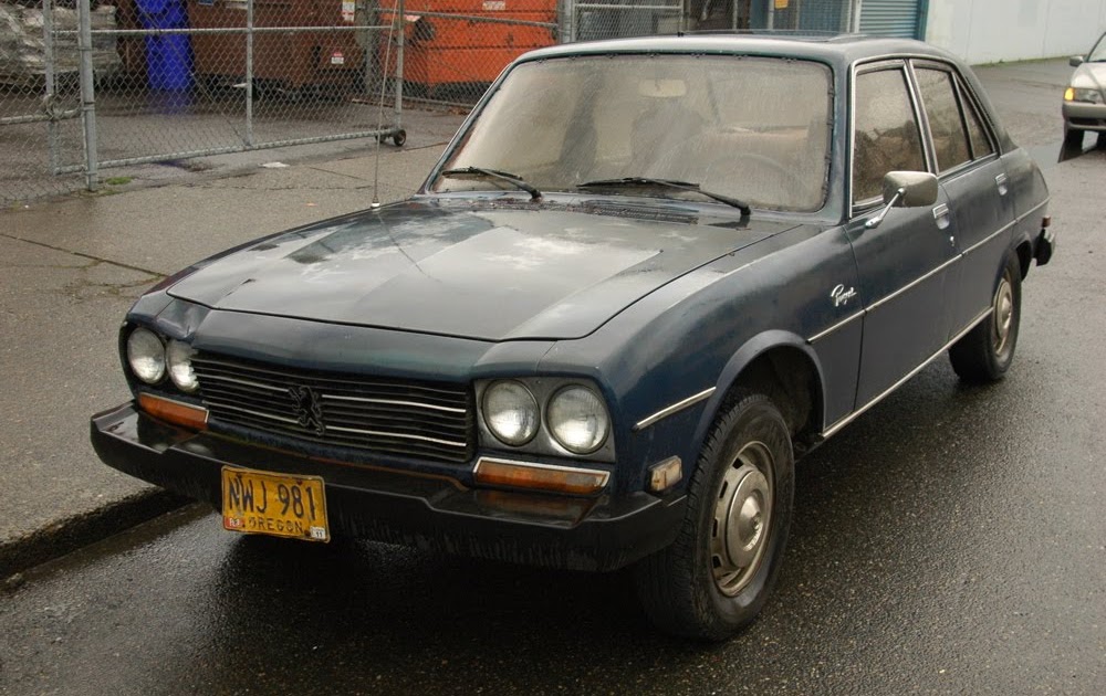 OLD PARKED CARS.: 1979 Peugeot 504 Diesel Sedan.