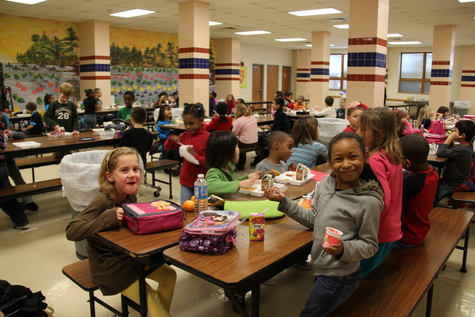 Bagel sandwich, corn chips, clementines, and a strawberry shortcake ...