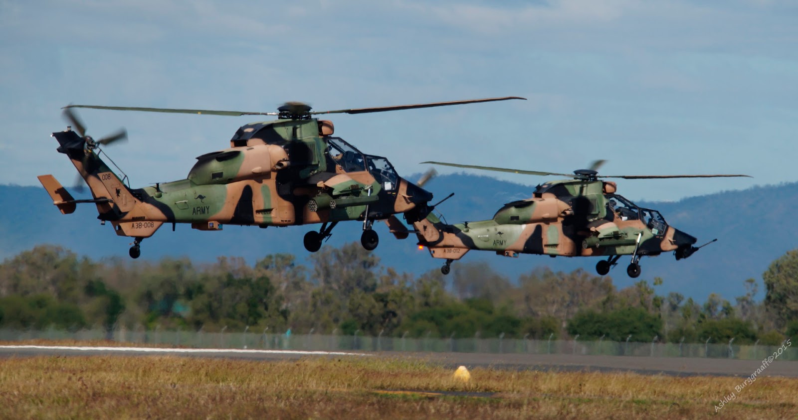 A pair of Tiger ARH hovers above Shoalwater Bay Training Area ...