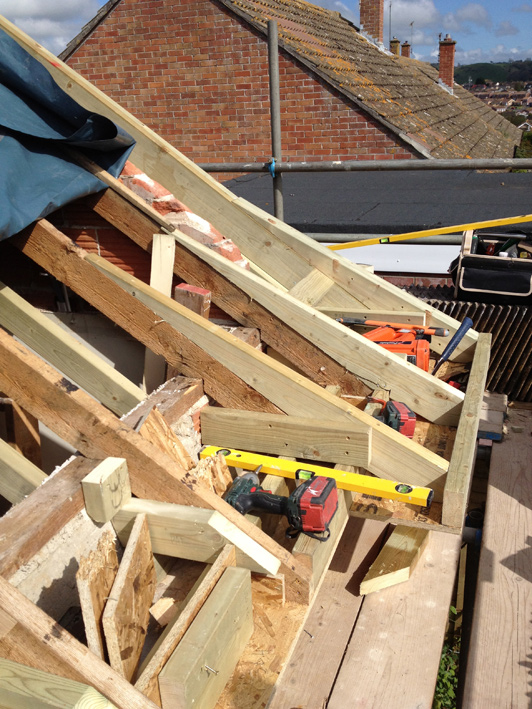 Rafter extensions to cover bale width at back corner of bungalow. The ...