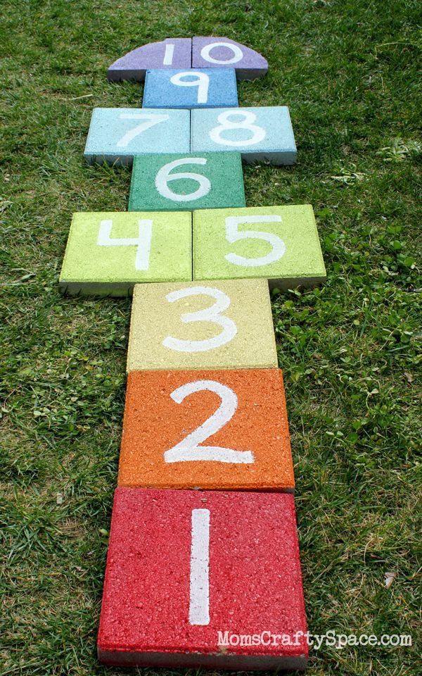 Super easy outdoor rainbow hopscotch - just use garden pavers and spr