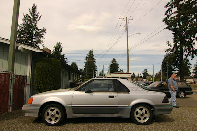 OLD PARKED CARS.: 1987 Ford EXP Sport Coupe.