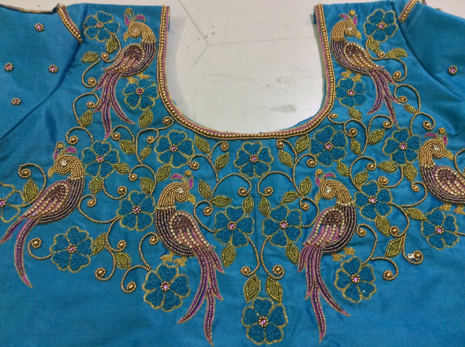 Hand embroidery designs for grand pattu pavadai