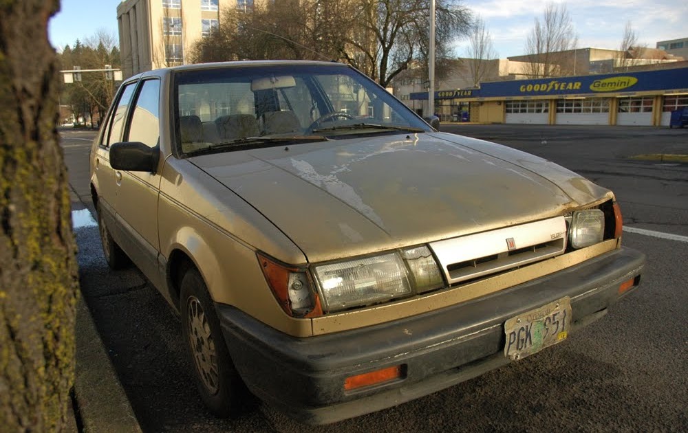 OLD PARKED CARS.: 1987 Isuzu i-mark.