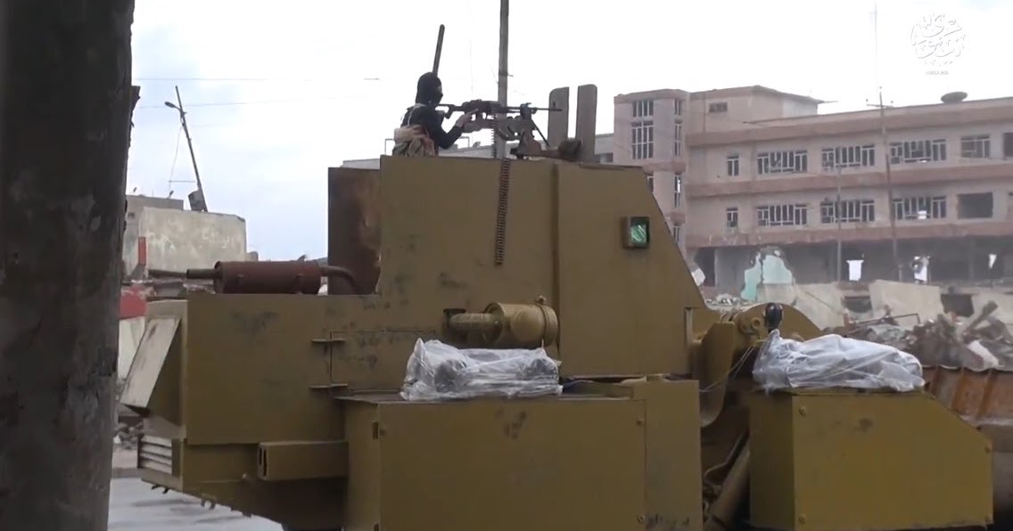 Levant War: An image of a two man Da'esh up armoured front-end loader ...