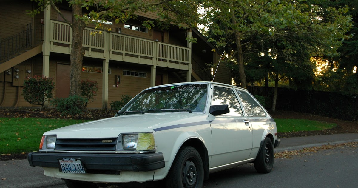 OLD PARKED CARS.: 1984 Mazda GLC.